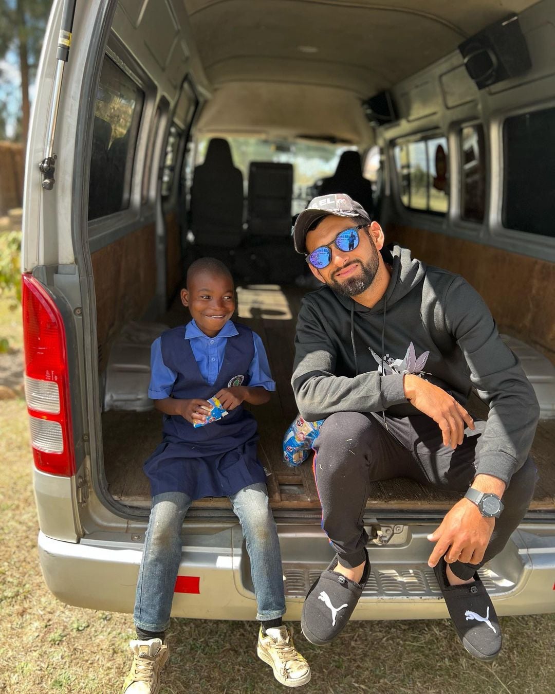 Sikandar Raza celebrating his teams win with kids