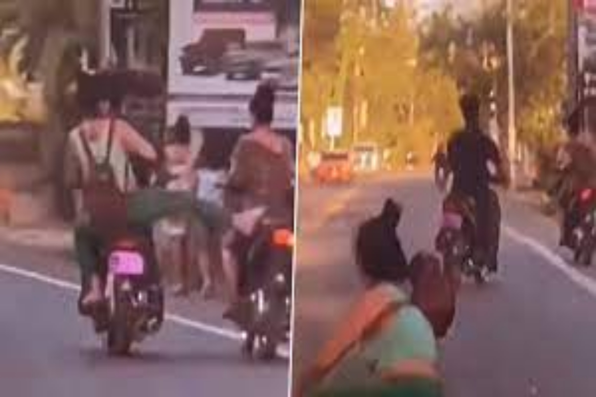 Viral Video: Woman fall off bike after trying to kick other rider